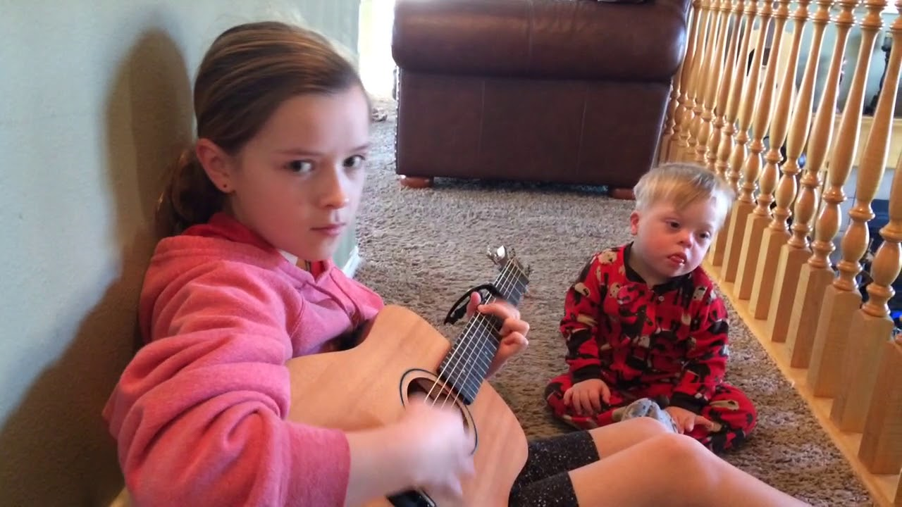 Bo Gray has Down syndrome. His sister Lydia, who sings him songs, helps ...
